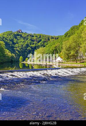 Bourscheid Castle on the river Sûre. In the foreground the facade of ...