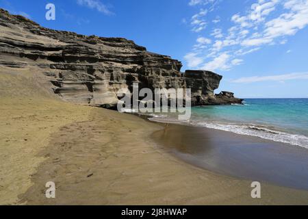 Mahana beach in Hawaii, one of only four green sand beaches of the ...