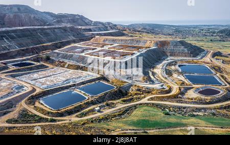Aerial panorama of Skouriotissa copper mine in Cyprus with ore piles ...