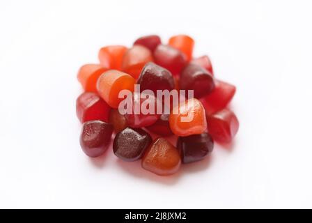 Multivitamin gummies red, orange and purple isolated on white ...