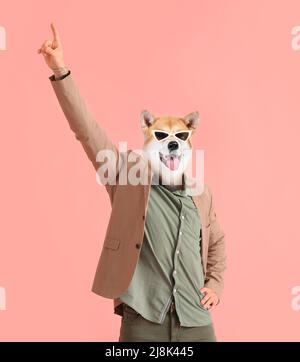 Funny dancing dog with human body on lilac background Stock Photo - Alamy