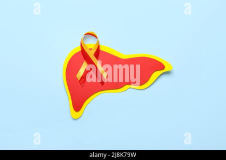 Awareness ribbon with paper liver on white background. Hepatitis ...