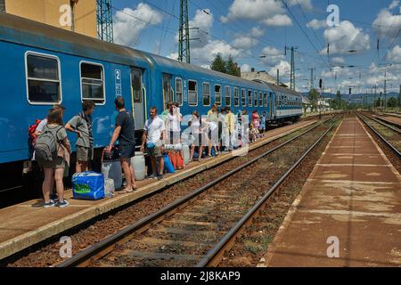 Group of students boarding a train Stock Photo - Alamy