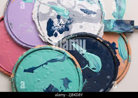 multi color old paint can lids Stock Photo - Alamy