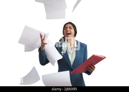 Young Venezuelan businesswoman stressed throwing paperwork, isolated ...