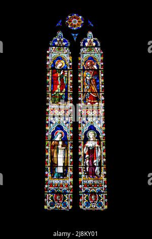 Light through stained glass rosettes, representing religious images ...