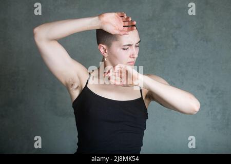 non binary pulling an angry, frustrated face Stock Photo - Alamy