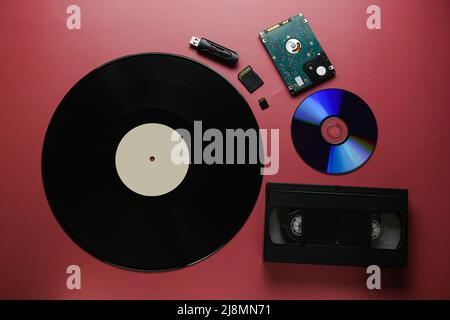 A closeup of VHS cassette, compact disc, audio cassette tape, vinyl ...