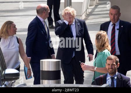 London - 17/05/2022. Prime Minister Boris Johnson is seen with his hand ...