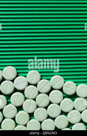 top view of round shape medication on yellow textured background Stock ...