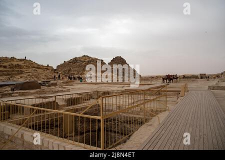 Ruins of the small pyramid of Queen Henutsen with Khafre Pyramids at ...