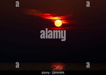 Romantic, blood red sunset with reflection on the sea Stock Photo - Alamy