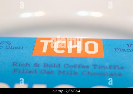 Close-up of logo for TCHO chocolate on chocolate bar against white ...