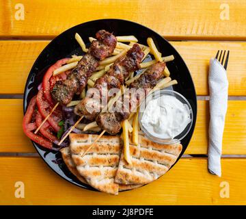 shish kebab with fried potato Stock Photo - Alamy