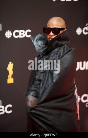 Sate wears a cape with the image of her mother Salmoe Bey on the Red ...