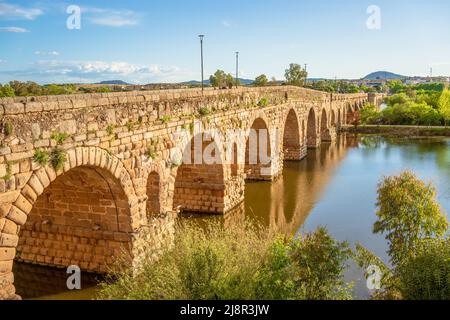 The Roman bridge of Merida spans the Guadiana River, highlighting its ...