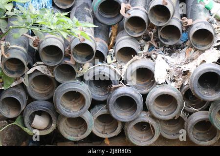 Old PVC plastic water supply pipes installed under house in crawlspace ...