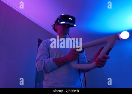 Man with virtual reality headset and joystic is playing game Concept of ...