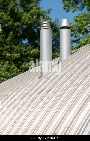 Round metal chimneys Stock Photo - Alamy
