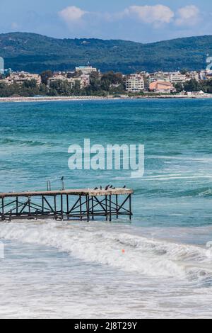 Old, abandoned jetty rotting away over the sea Stock Photo - Alamy