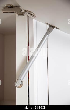 Retractable gas shock absorber for opening the drawer in the kitchen ...