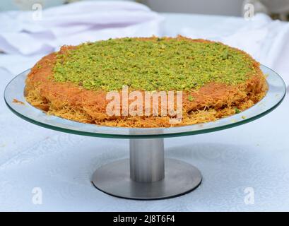 Traditional Arabic Kunafa isolated on white background Stock Photo - Alamy