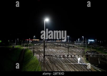 Freight station at night in Zurich, Spreitenbach. Freight trains are ...