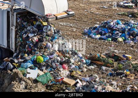 Truck unloading garbage on an open air dump. Waste recycling Stock ...