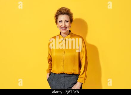Photo of cheerful positive good mood man dressed green pullover hold ...