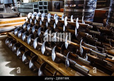 Augers. Screw machine parts in the factory Stock Photo - Alamy