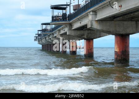 bridge extending into the distance of the sea. beautiful view of the ...