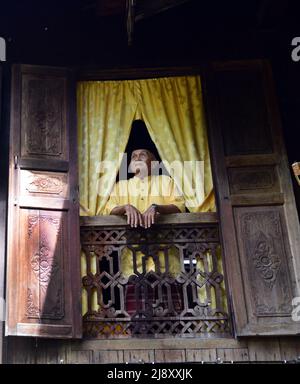 A Malay man wearing a traditional cap Stock Photo - Alamy