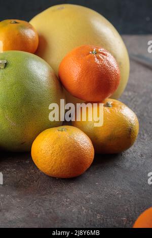 Fresh ripe citrus geen orange on a dark background Stock Photo - Alamy