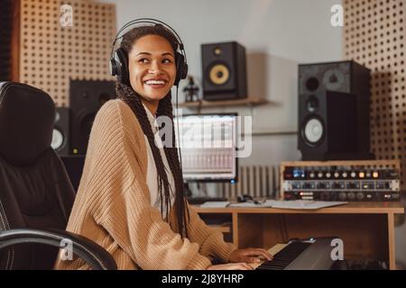 Multiracial woman, musician singer composer guitarist and songwriter ...
