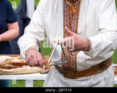 Tsymbaly ethnic musical instrument striking two beaters. Musician man ...