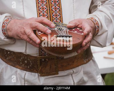 Musician plying mbira ethnic musical instrument. Ukraininan kalimba ...