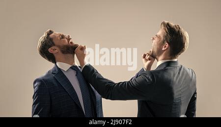 fighting businesspeople. dissatisfied men. fist in face. colleagues ...