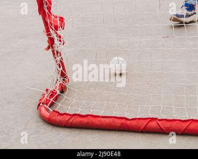 Floorball goal ready for training. Children playing outdoor in spring ...