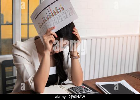 Tired stressful and upset businesswoman with graph report problem and ...