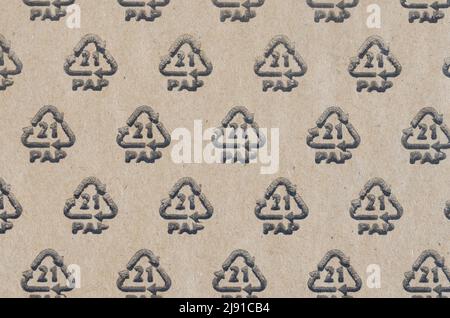Cardboard with recyclable symbol and inscriptions. Cardboard texture ...