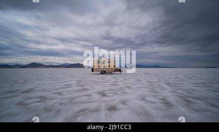 Vintage boler trailer parked on the Bonneville salt flats with big open ...
