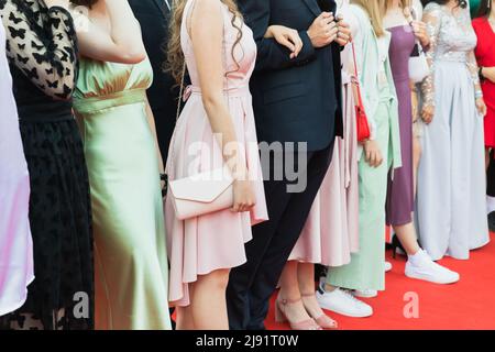 Feet of prom guests standing on a red carpet, close up photo Stock ...