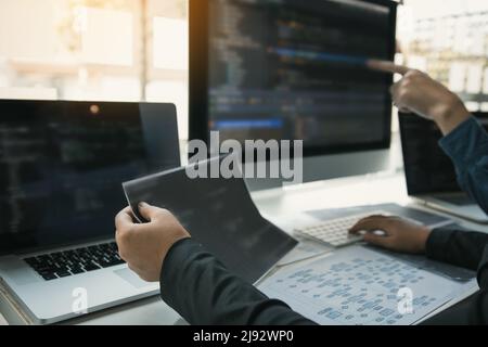 Software developers are analyzing about the code written into the ...