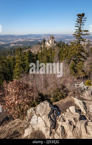 The Gothic castle Kasperk rises on a rocky peak. It is the highest ...