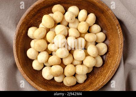 Small, round and fragrant nut macadamia Stock Photo - Alamy