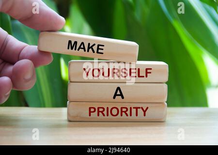 Self-care quotes, make yourself a priority words and female hands on ...