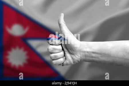 Hand making victory sign, nepal painted with flag as symbol of victory ...
