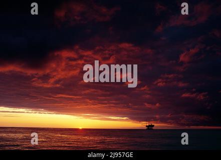 Australia. Industry. Bass Strait. Offshore oil platform at sunrise ...