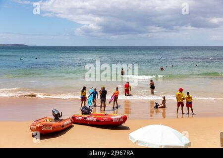 Surf rescue boats red zodiac, on Manly Beach with surf life savers ...