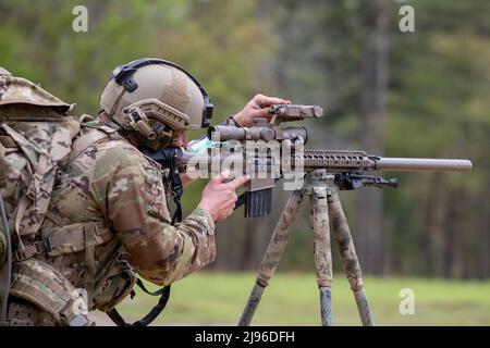 A sniper from the U.S. Army 10th Special Forces Group (Airborne) rests ...